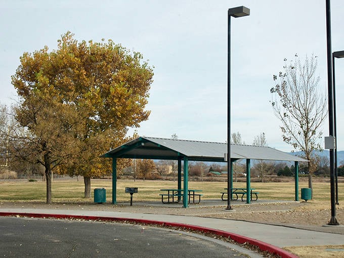 Heritage Park's simple pavilions and golden cottonwoods offer the kind of unpretentious gathering spot where community happens naturally.