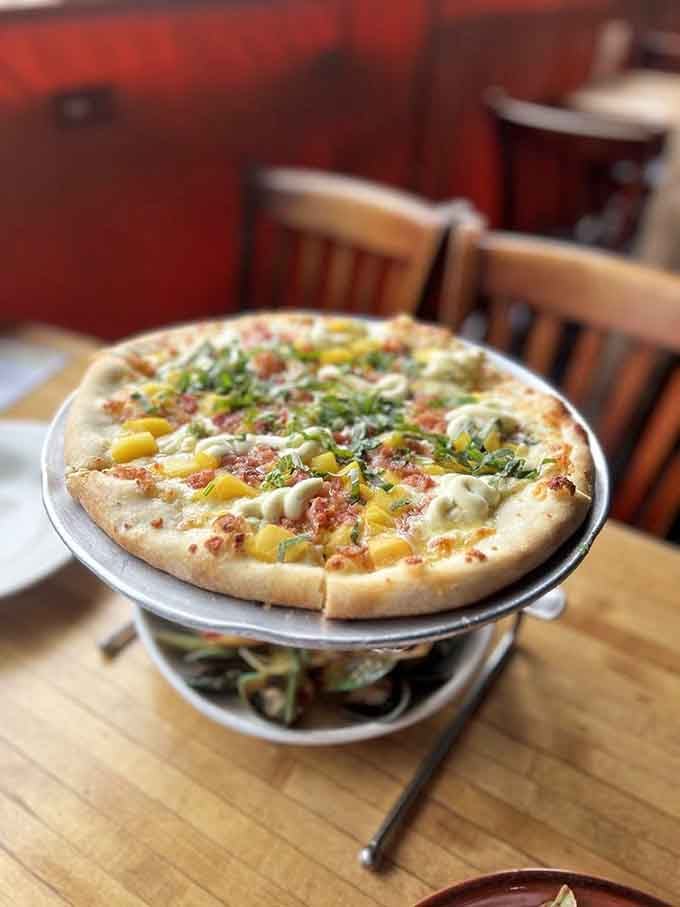 Pizza elevated on a pedestal because some dishes deserve their moment in the spotlight, literally and figuratively.