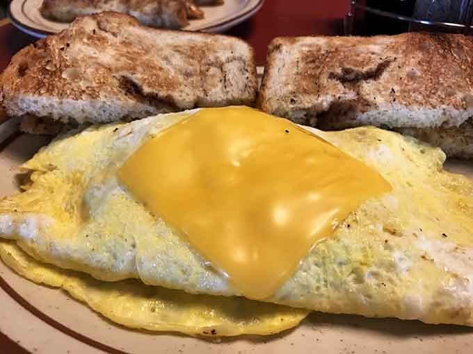 That fluffy Western omelet paired with perfectly toasted bread proves simple ingredients can create breakfast perfection.