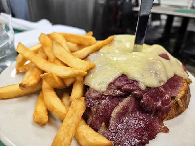 That blanket of melted Swiss over tender corned beef is basically a warm hug on a plate with fries.