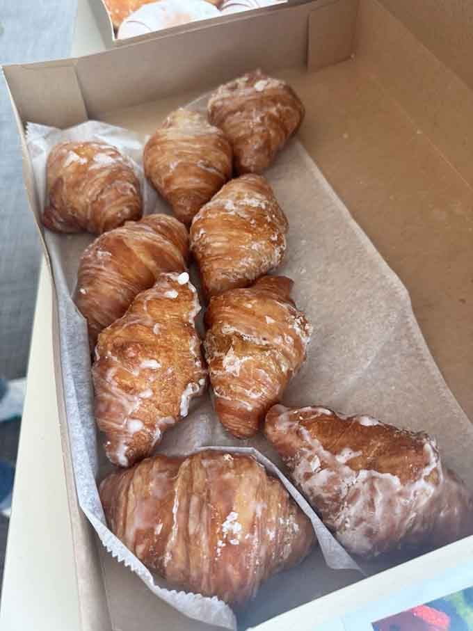 Glazed croissants lined up like golden soldiers, ready to make your morning infinitely better than it was.