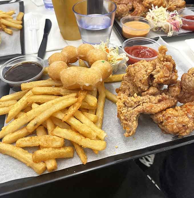 Golden fried chicken and crispy fries arrive ready to fuel your journey through this illustrated wonderland.