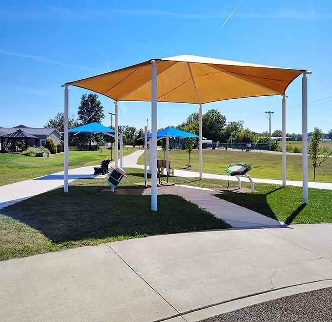 That shade structure knows Indiana summers can be brutal, offering respite like a good neighbor lending you their porch.