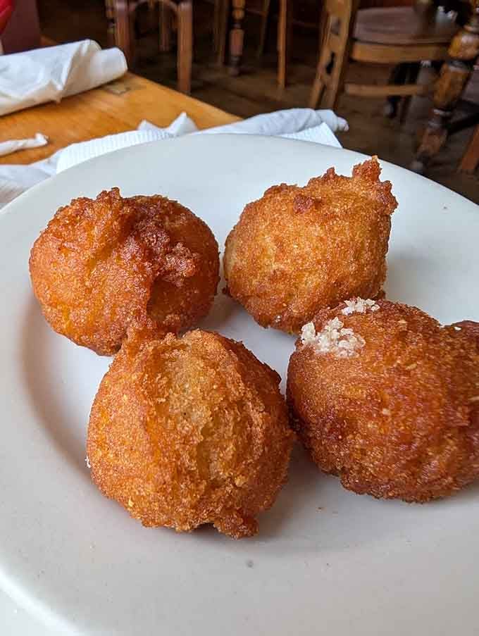 Golden hush puppies so perfectly fried they could make a grown person weep tears of pure joy.