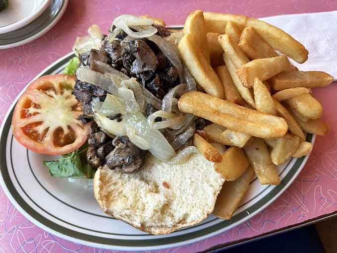 The Baldouni Burger arrives with caramelized onions that could make a grown person weep with joy.