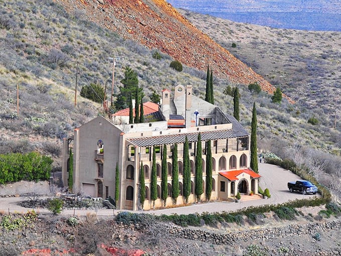 The Little Daisy Hotel stands proudly with its cypress trees, a Mediterranean oasis on an Arizona mountainside.