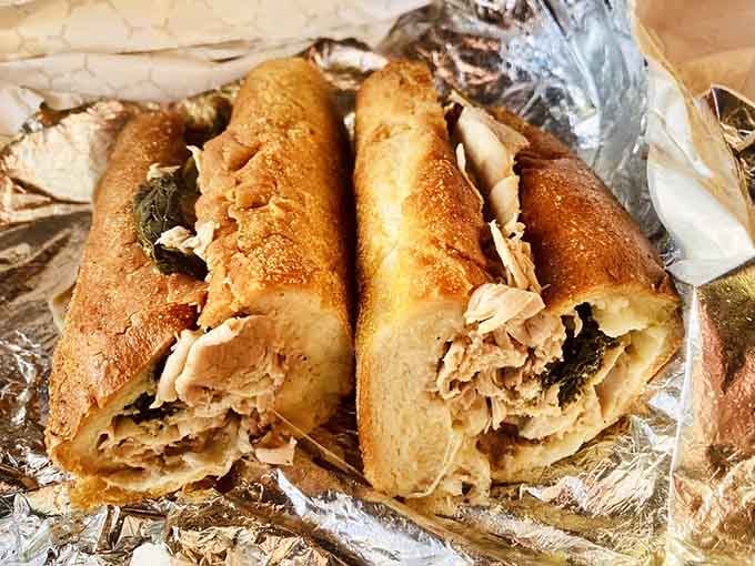 The roast pork sandwich wrapped in foil like a delicious gift you're about to give yourself.