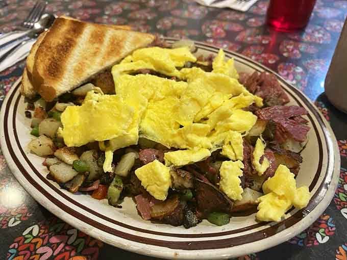 Corned beef hash topped with scrambled eggs is the kind of hearty breakfast that makes you forget kale ever existed.