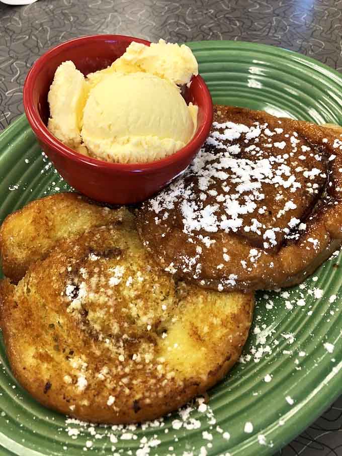 Golden French toast meets powdered sugar and vanilla ice cream in a combination that would make Elvis weep with joy.
