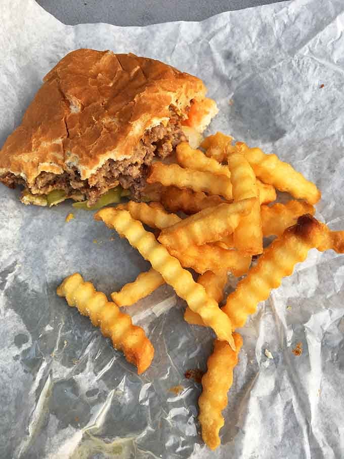 Half-eaten burgers and crinkle-cut fries are the universal sign that someone's having an absolutely fantastic day right now.