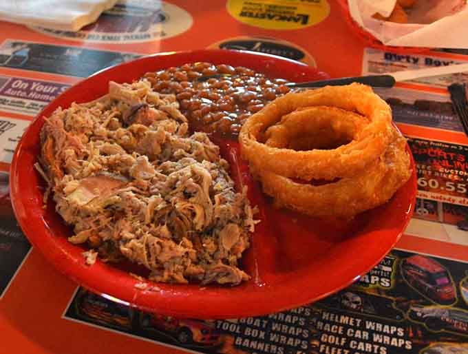 When your pulled pork comes with baked beans and onion rings, you know someone understands proper barbecue priorities.
