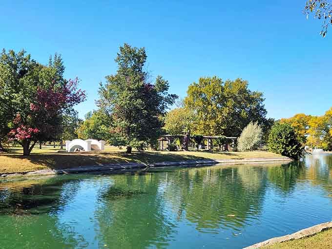 Liberty Park's serene pond reflects the surrounding greenery, offering a peaceful escape just minutes from downtown Sedalia.