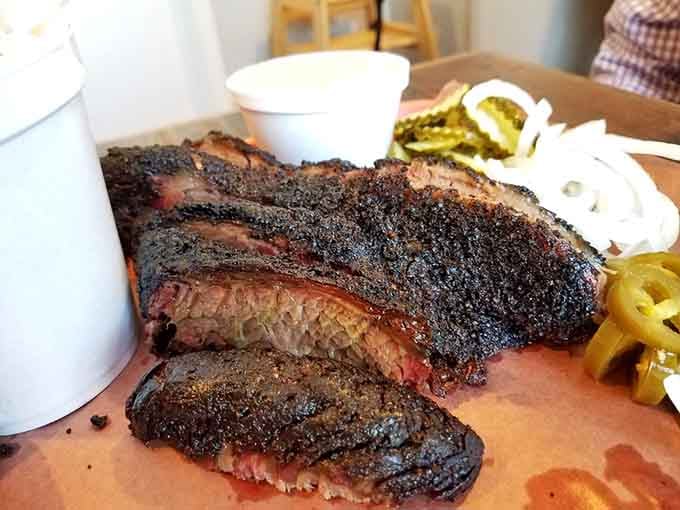 That dark crust and pink smoke ring tell you everything you need to know about proper brisket.