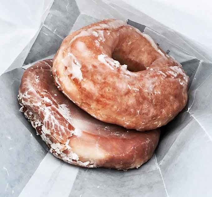 These glazed beauties achieve what philosophers have pondered for centuries: absolute perfection in circular form with a hole.