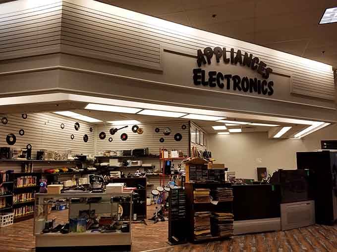 The appliances and electronics section where small gadgets wait patiently to make your morning coffee routine affordable again.