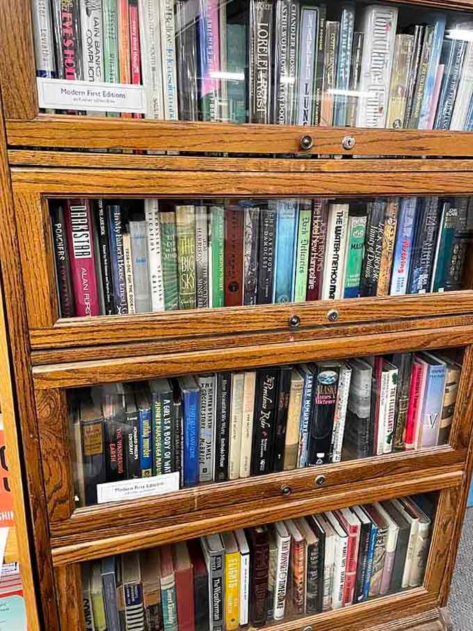 Modern first editions behind glass remind us that some books are investments, not just weekend entertainment.