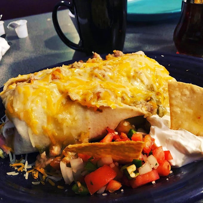 This burrito is stuffed so generously it looks like it's about to audition for a superhero movie as The Incredible Bulk.