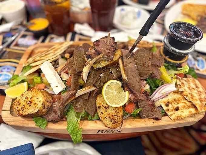 The Greek gyro platter arrives like a delicious wooden ship loaded with Mediterranean treasures and grilled perfection.
