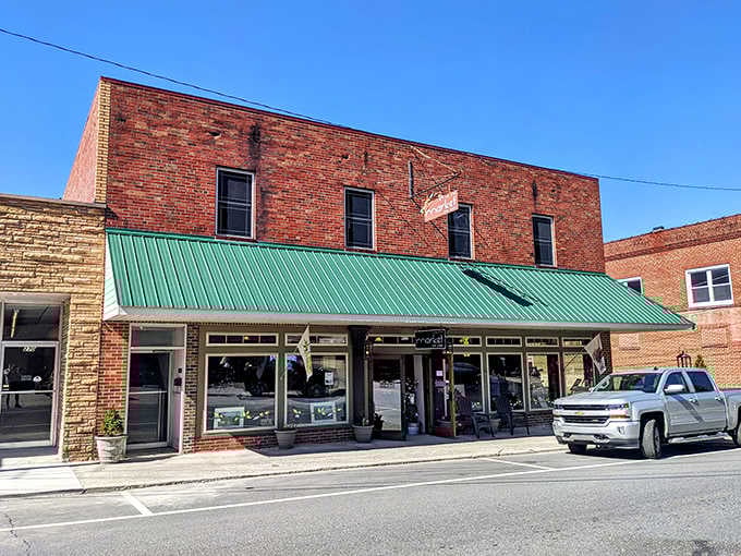 Market on Oak exemplifies small-town retail charm with its classic brick facade and green awning&mdash;the antithesis of big-box anonymity.