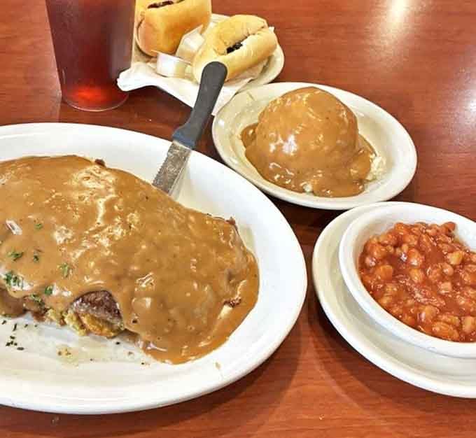 Comfort food nirvana! This gravy-smothered masterpiece proves that sometimes the most photogenic meals are the ones that make you want to lick the plate clean.