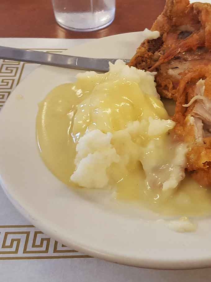 Mashed potatoes and gravy done right&mdash;creamy, buttery clouds with a golden river of gravy that would make your grandmother nod in approval.