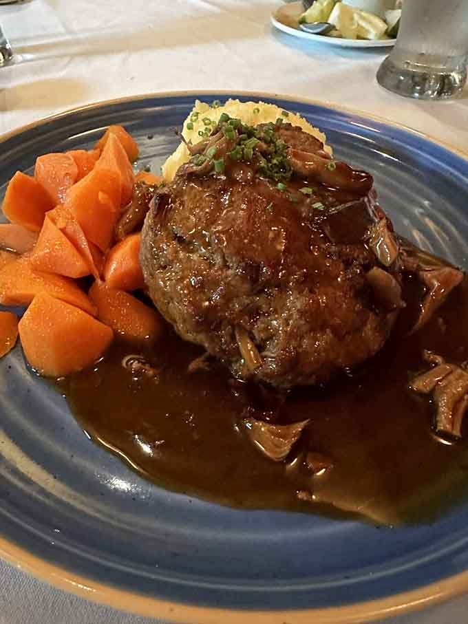 This meatloaf isn't your Monday night leftover nightmare&mdash;it's a masterpiece of comfort food elevated to art form, swimming in a sauce you'll want to bottle.