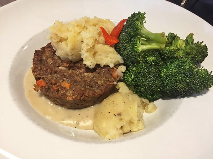 Comfort food gets an artistic upgrade with this hearty meatloaf, mashed potatoes, and perfectly steamed broccoli—a plate Norman Rockwell would paint.