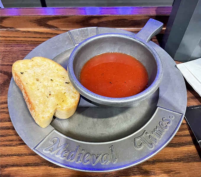 Tomato bisque served in pewter because even soup gets the royal treatment at this castle.