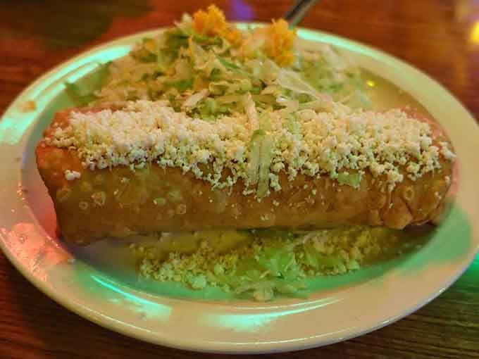 Carne seca burrito smothered in green chile, proving that dried beef never looked or tasted this magnificent.