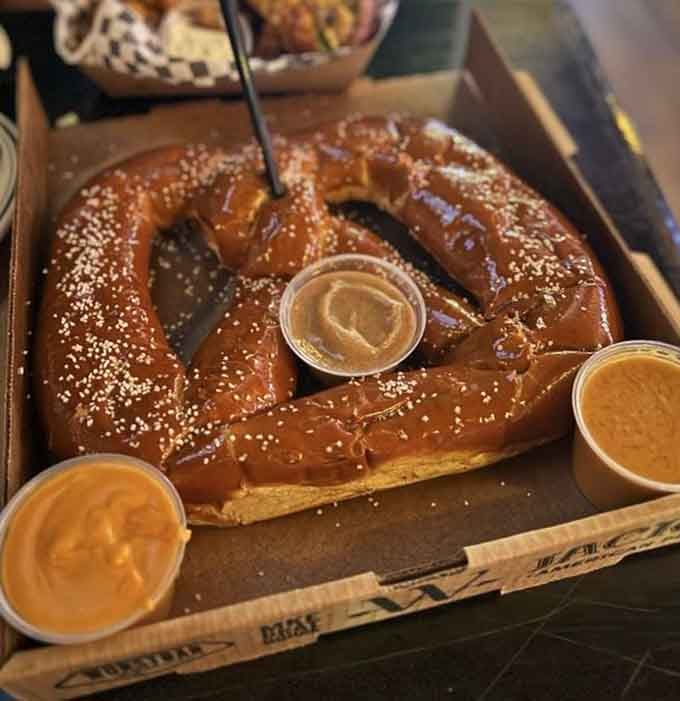This Bavarian pretzel is so massive it practically needs its own zip code and comes with cheese sauce dreams.