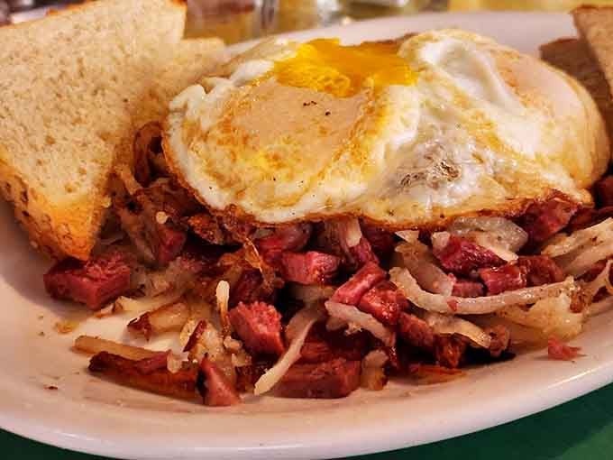 Corned beef hash topped with perfectly cooked eggs, because some mornings demand this level of delicious commitment.