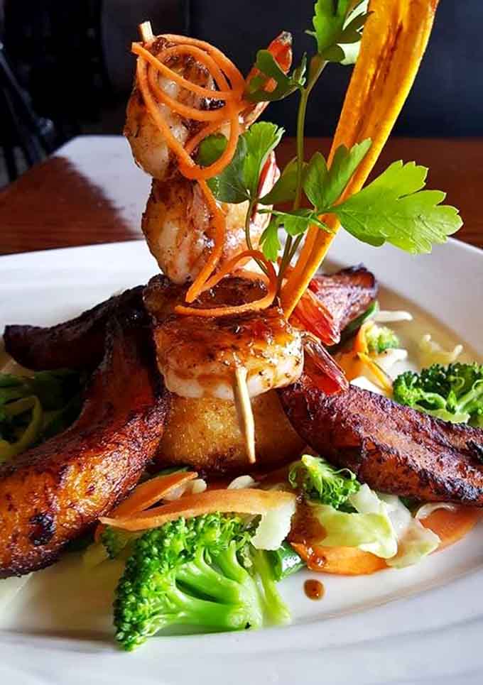 Coconut grit cake with shrimp that'll make you rethink everything you thought you knew about Southern-Caribbean fusion cooking.