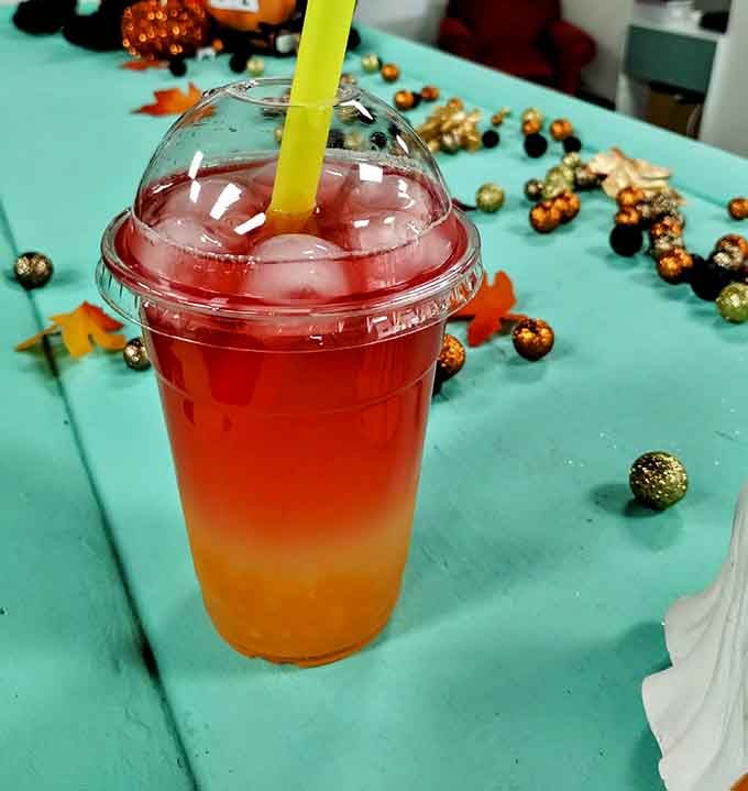 This gradient drink looks like a sunset in a cup, proving that beverages can be Instagram-worthy even without a cat photobombing.