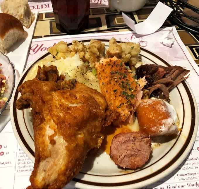 A plate piled high with fried chicken, mashed potatoes, and all the fixings your grandmother would approve of.