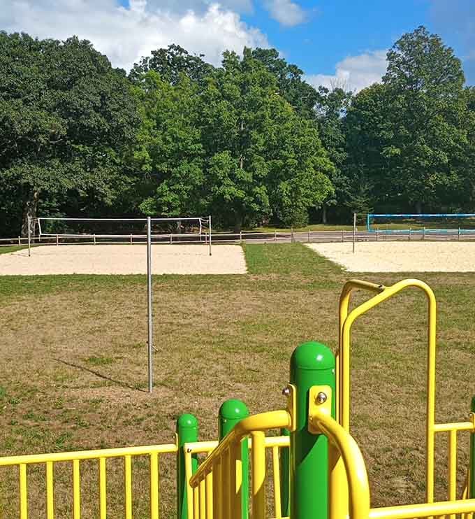 Volleyball courts and recreation areas sit ready for action, because staying active shouldn't cost more than your cable bill.