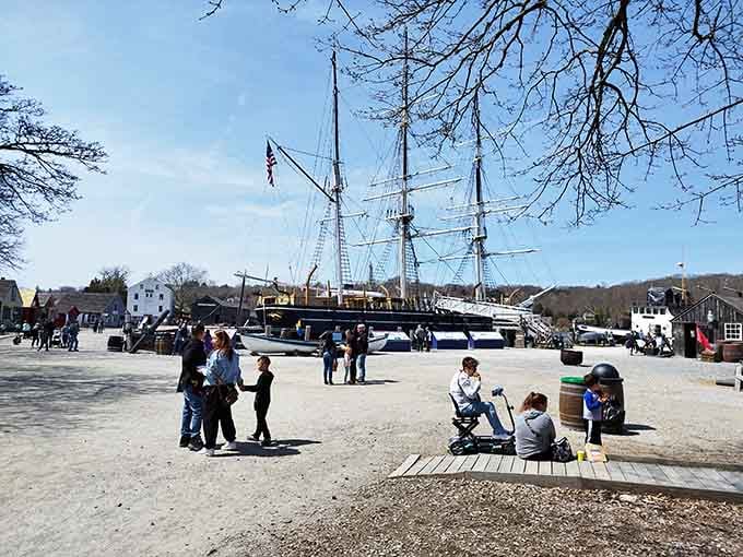 Families gather near tall ships on a perfect spring day, proving history is best experienced together under blue skies.