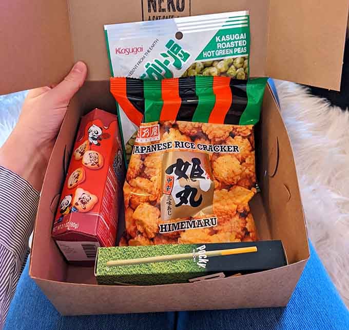 Your Japanese snack box comes with everything needed for a proper cat cafe experience, chopsticks included naturally.