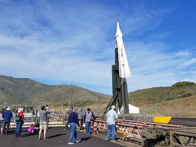 Visitors gather around a Nike missile on its launcher, probably reconsidering what they thought qualified as "big."