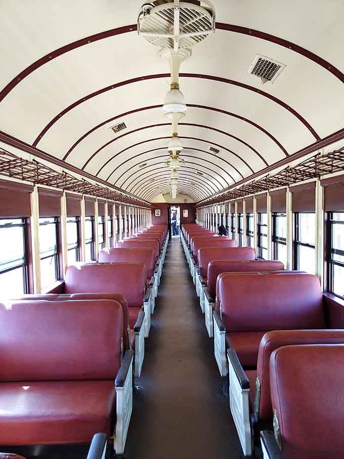 That curved ceiling and burgundy trim transport you straight back to when train travel was the height of elegance.
