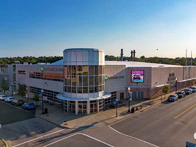 The Northwest Arena anchors downtown Jamestown's entertainment district, hosting everything from hockey games to concerts in its gleaming modern facility.