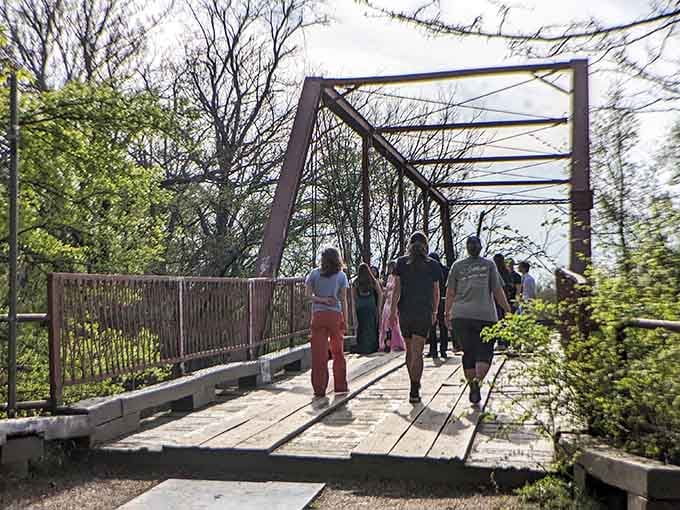 Visitors stroll across in broad daylight, smart cookies who know the best ghost hunting happens with sunshine.