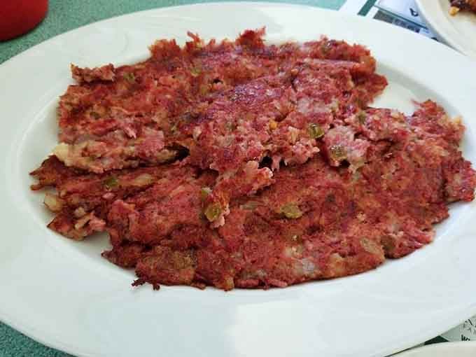 Homemade corned beef hash with a golden crust that crackles like autumn leaves under your fork, breakfast perfection achieved.
