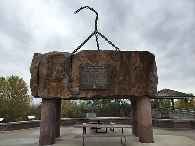 That massive granite boulder suspended in chains tells stories older than your great-great-grandparents could imagine.