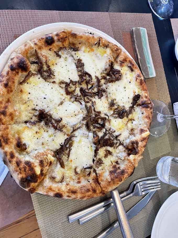 This mushroom white pizza proves that sometimes the best pies skip the red sauce entirely for pure cheesy bliss.