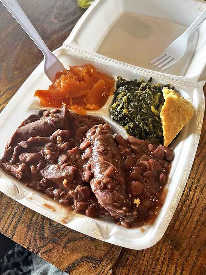 Red beans and sausage that have clearly been simmering since yesterday, alongside greens and cornbread that complete the holy trinity of Southern comfort.