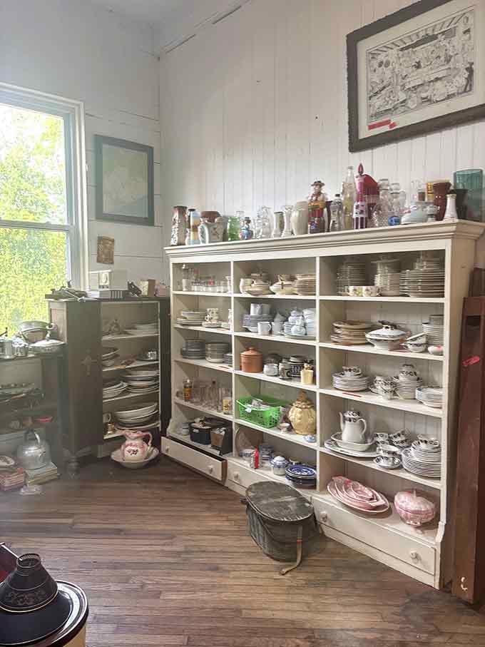 Vintage dishware stacked like edible archaeology, each piece telling stories of dinner parties and Sunday suppers from decades past.
