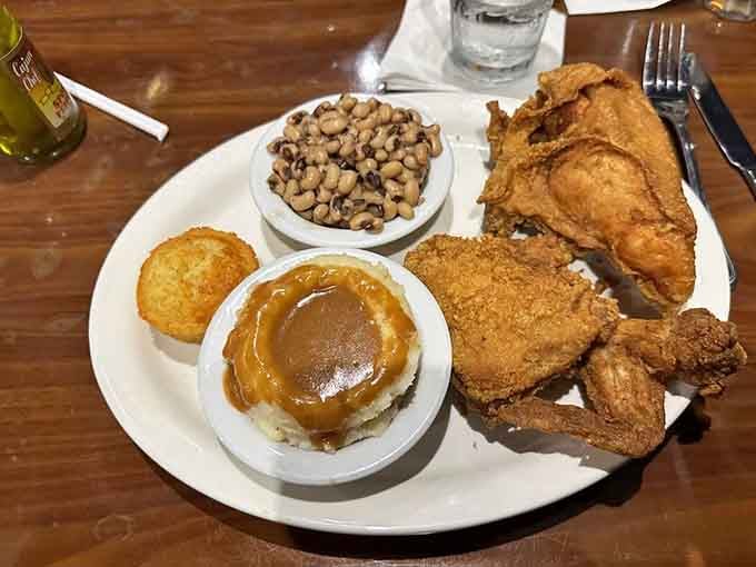 Golden fried chicken with black-eyed peas and cornbread: this plate could make a vegetarian reconsider their life choices.