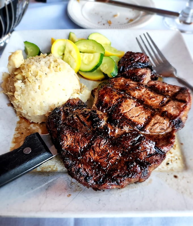 Charred to perfection with creamy mashed potatoes, this steak proves why people drive miles for the real deal.