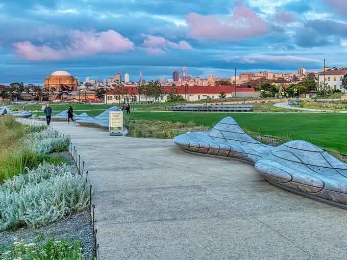 San Francisco's skyline rises behind meadows that shouldn't exist but do, proving engineers have excellent imaginations sometimes.