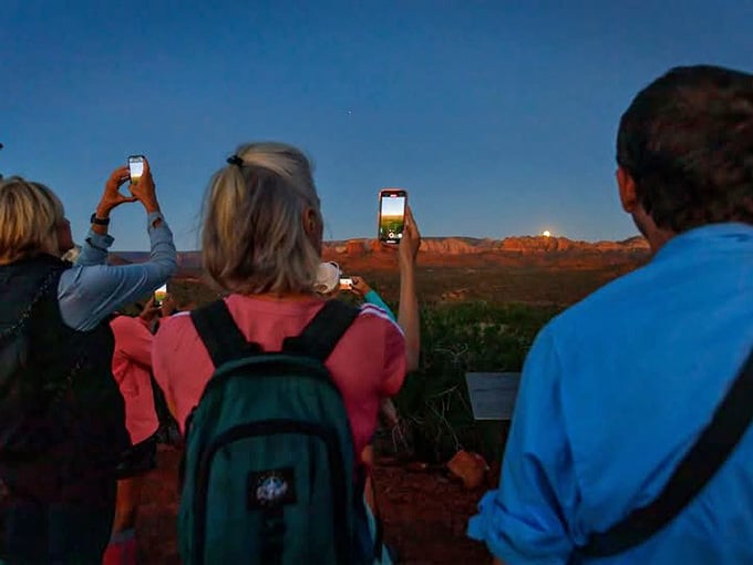 Under the full moon, hikers gather for an experience that turns the familiar landscape into something wonderfully otherworldly.